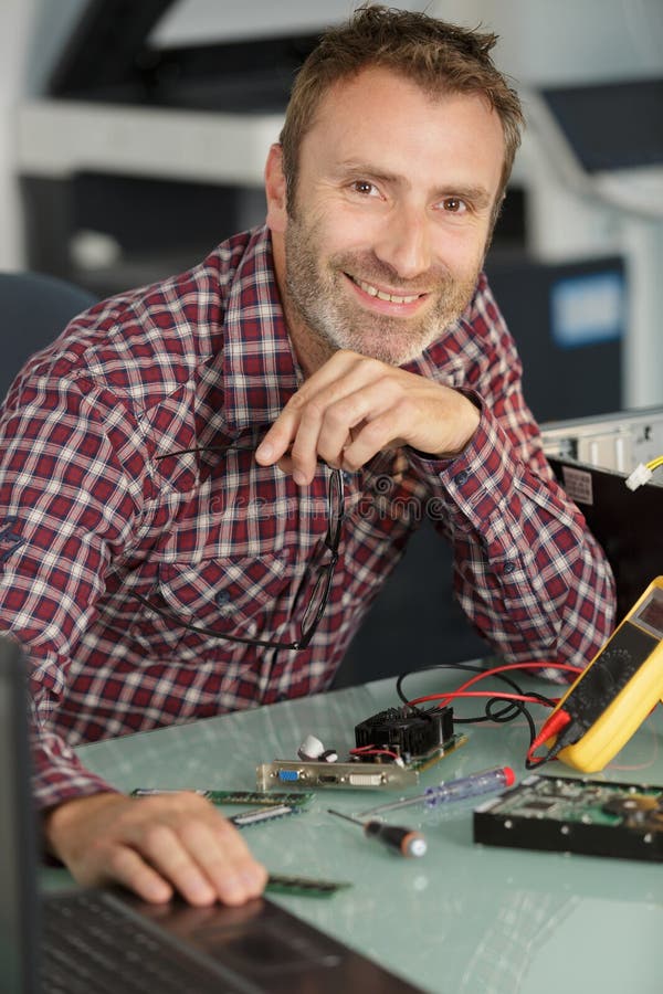 Happy Man Fixing Electronics Stock Photo - Image of soldering ...
