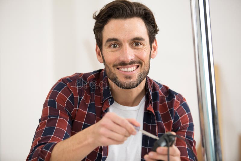 Happy Man Fixing Furniture at Home Stock Image - Image of male ...