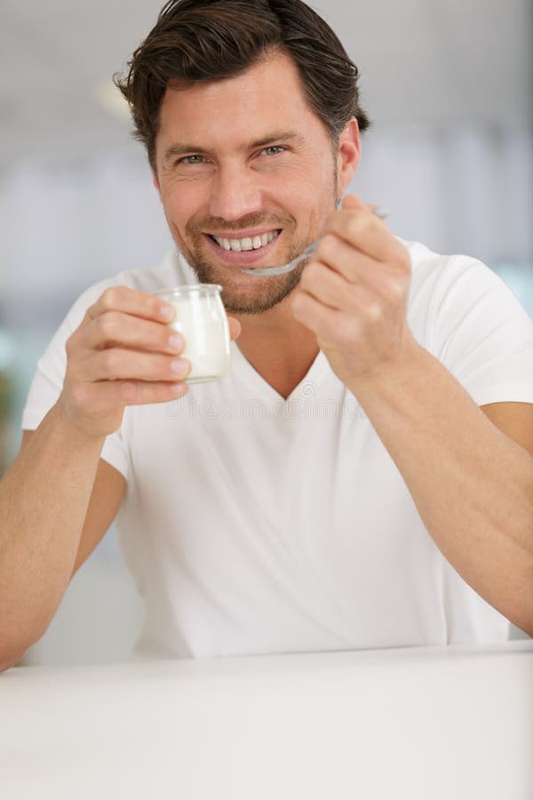Happy man having breakfast stock image. Image of portrait - 267511191
