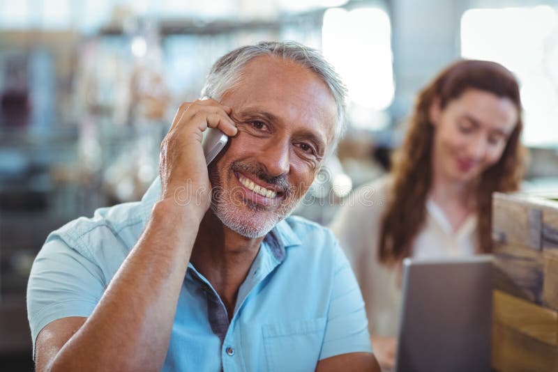 Happy Man Having Phone Call and Smiling at Camera Stock Photo - Image ...