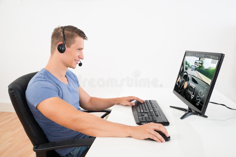 Man with Headset Playing Game on Computer Stock Image - Image of device ...