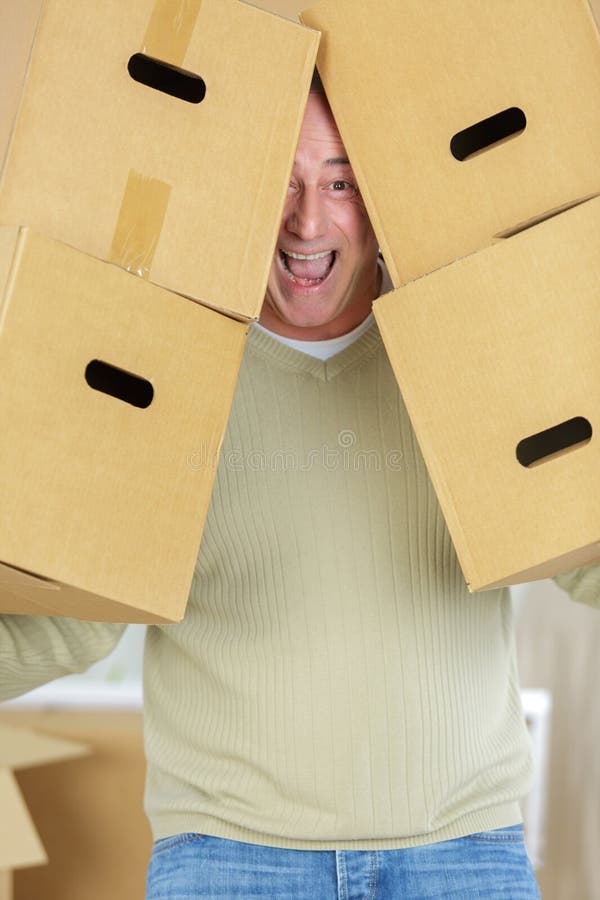 Happy Man Hidding Behind Boxes Stock Image - Image of good, positive ...