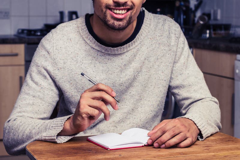 Happy Man is in His Kitchen Keeping a Diary Stock Photo - Image of ...