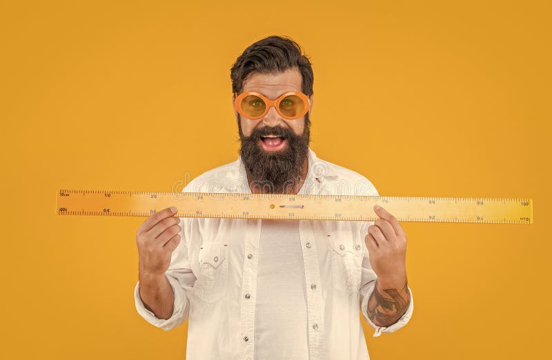 Happy Man Hold Geometry Ruler Isolated on Yellow. Man Hold Geometry ...