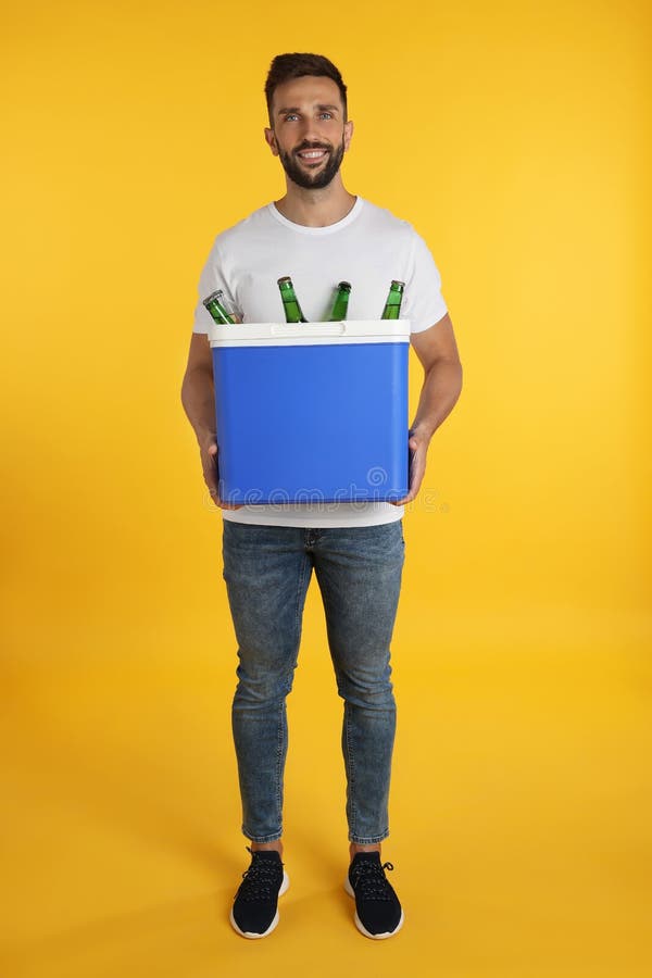 Happy Man Holding Cool Box with Bottles of Beer on Yellow Background ...
