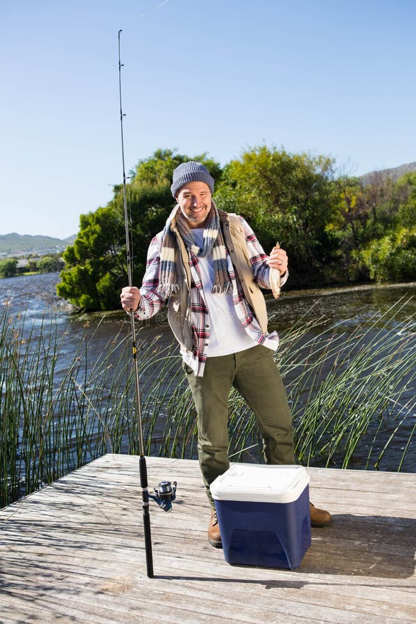 Happy man holding fish stock photo. Image of recreation - 51693754