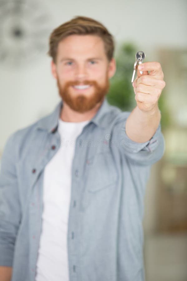 Happy man holding keys stock image. Image of hold, future - 267510941