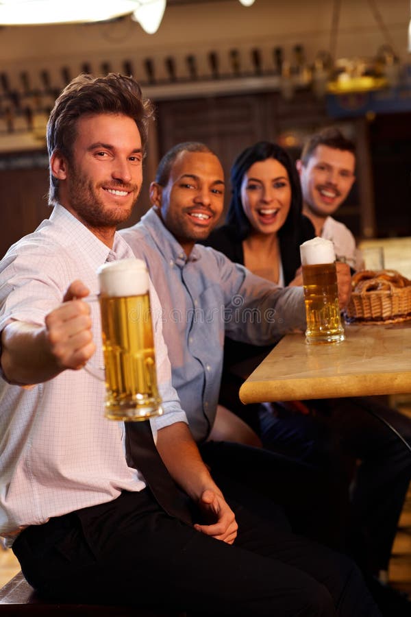 Happy Man Holding Mug of Beer in Pub Stock Photo - Image of friendship ...
