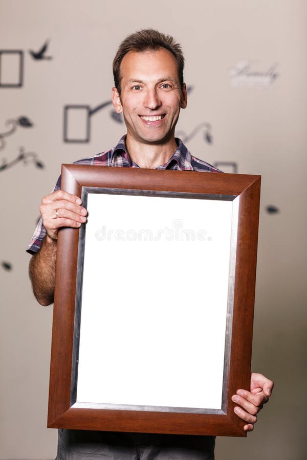 Happy Man Holding Portrait Frame Stock Photo - Image of male, cute ...