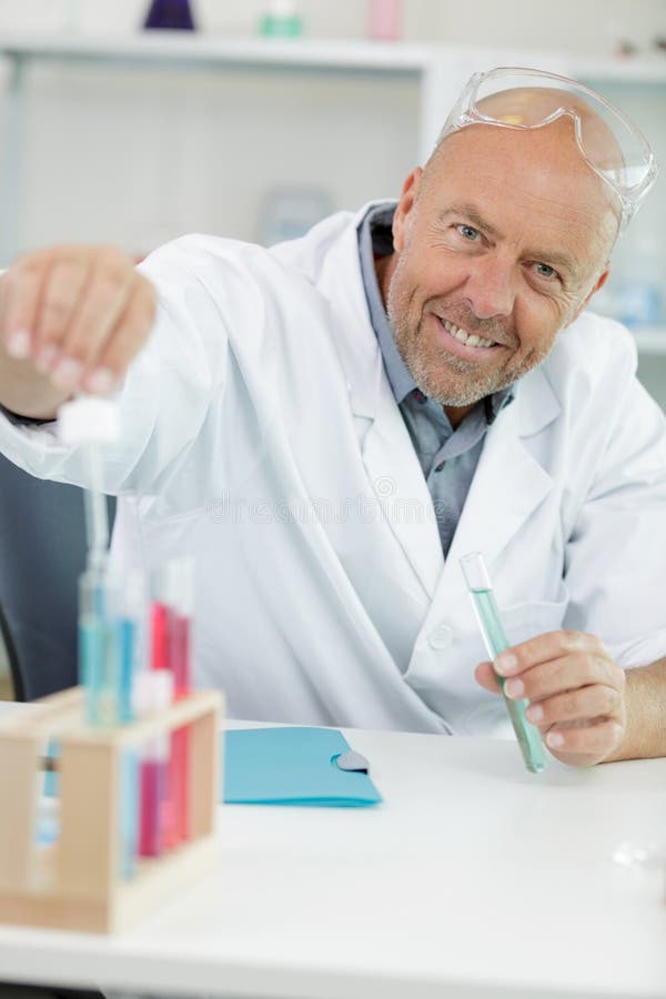 Happy Man Holding Test-tube at Laboratory Stock Photo - Image of ...