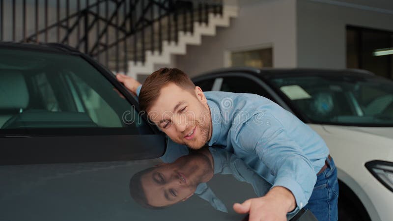 A Happy Man Hug His New Electric Car Stock Video - Video of retail ...