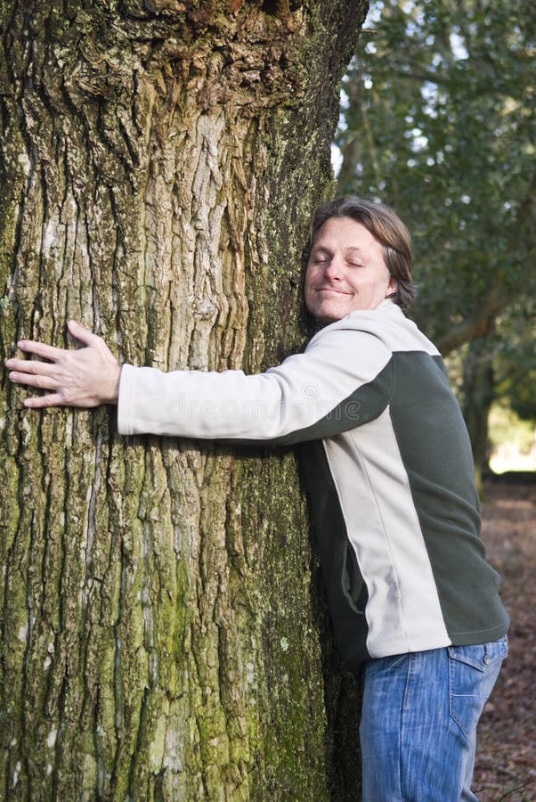 Happy man hugging tree stock photo. Image of calm, autumn - 12725360