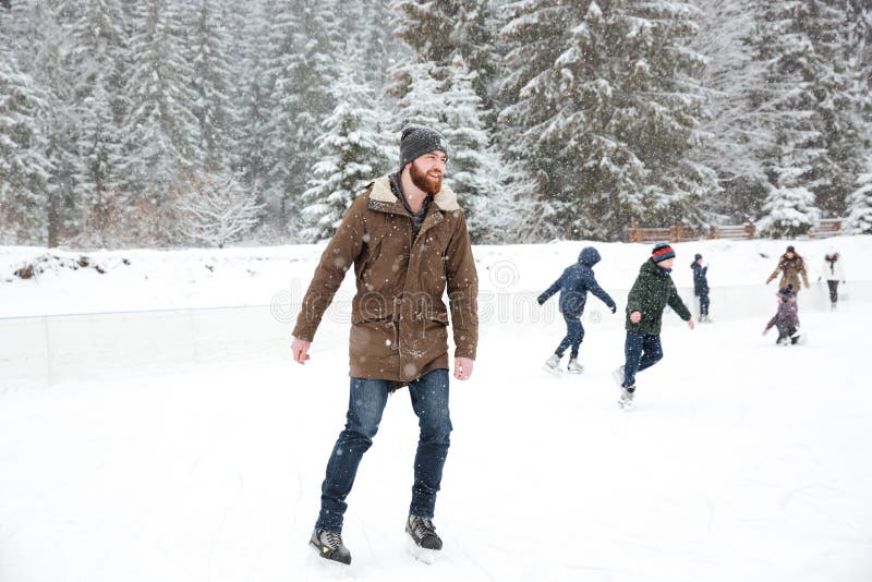 Happy Man Ice Skating Outdoors Stock Photo - Image of length, travel ...