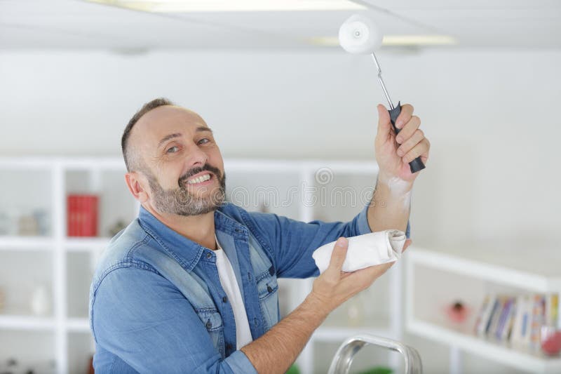 Happy Man Installing Spotlight in Room Stock Photo - Image of power ...