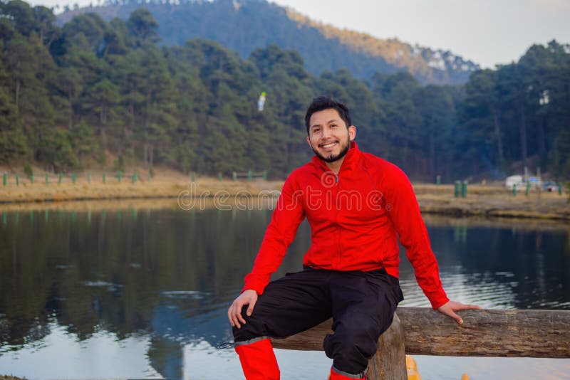 Happy man by the lake stock image. Image of shot, smile - 240216549