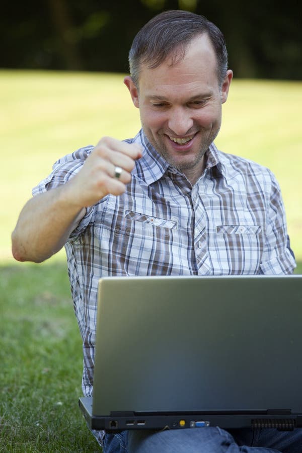 Happy Man with Laptop Outdoor Stock Photo - Image of laptop, grass ...