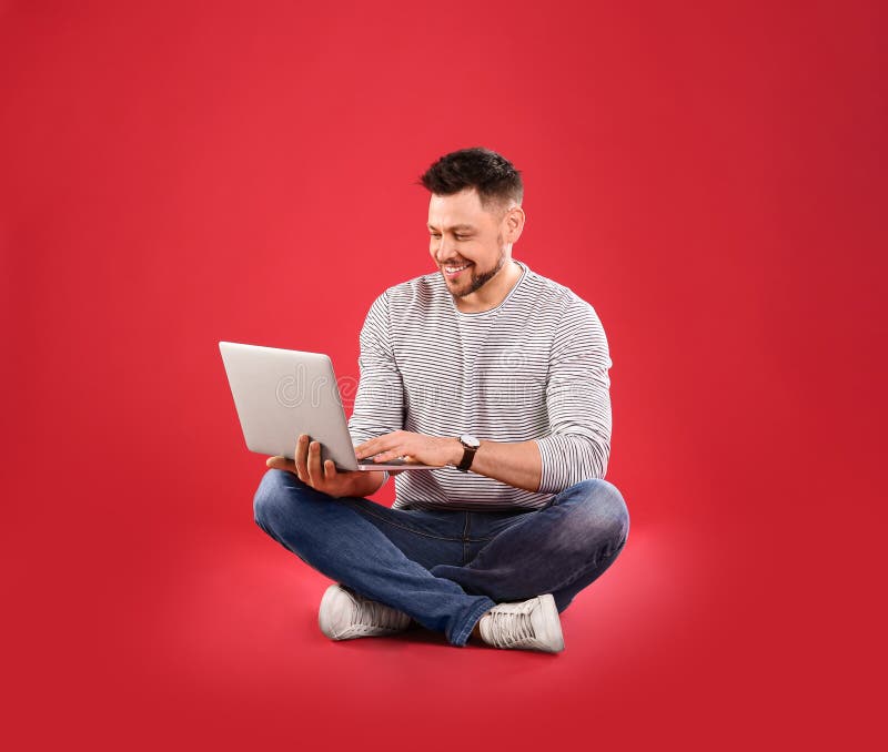 Happy Man with Laptop on Red Background Stock Photo - Image of smiling ...