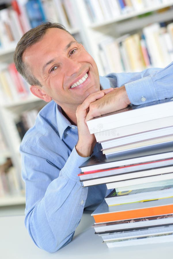 Happy man in library stock image. Image of survey, teller - 262850173