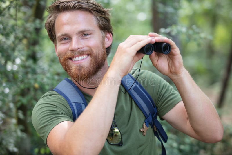 Happy Man Looking through Binoculars Stock Image - Image of view, tree ...