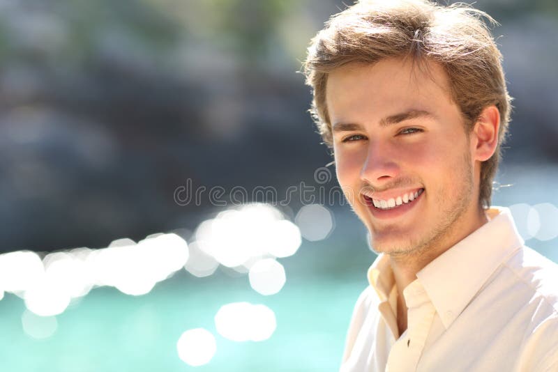 Happy Man Looking at Camera on the Beach Stock Photo - Image of male ...