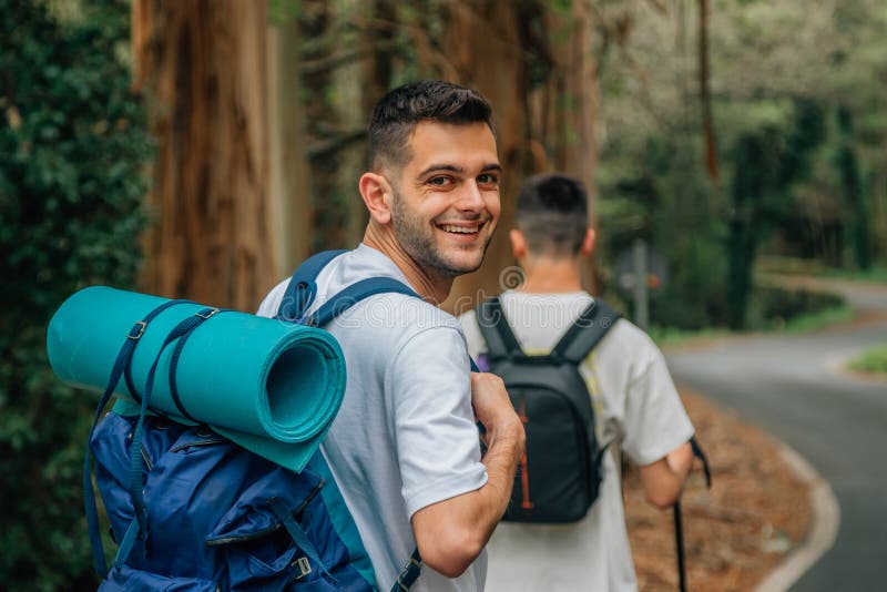Man Looking at the Camera while Hiking Stock Image - Image of enjoyment ...