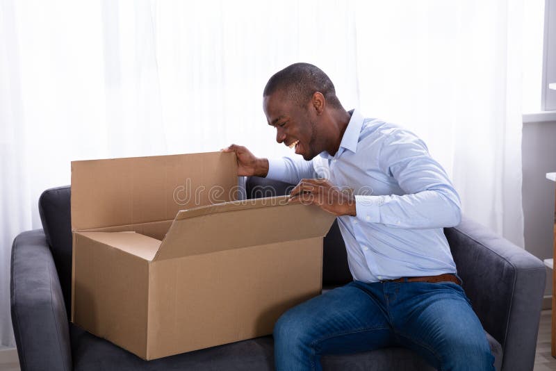 Happy Man Looking Inside Package Stock Photo - Image of pack, delivery ...