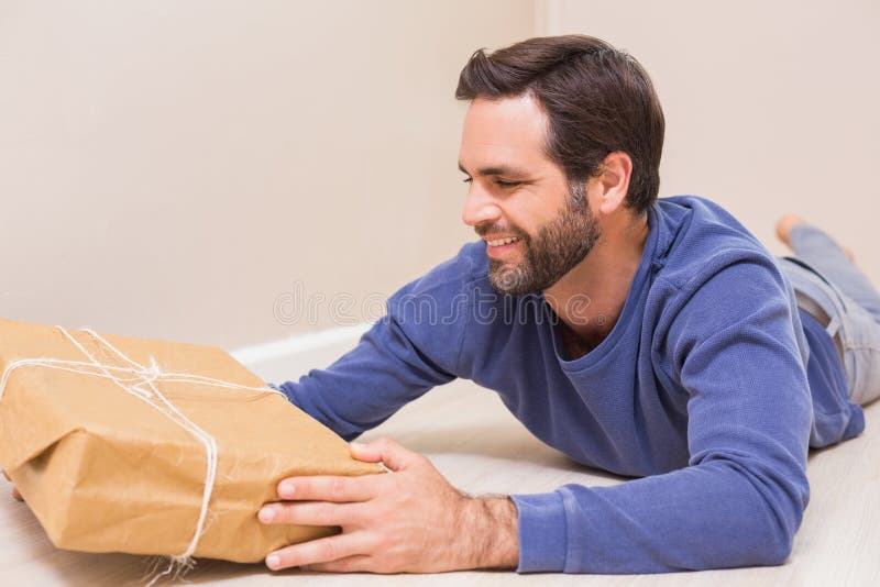 Happy Man Looking at Package Stock Photo - Image of apartment, holding ...