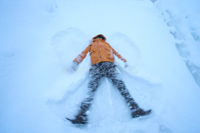Happy Man Lying Down on the Snow in Winter Stock Image - Image of snowy ...