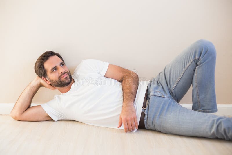 Happy Man Lying on the Floor Stock Image - Image of home, wall: 47013287