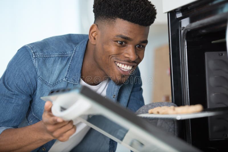Happy man making cookies stock image. Image of party - 266081529