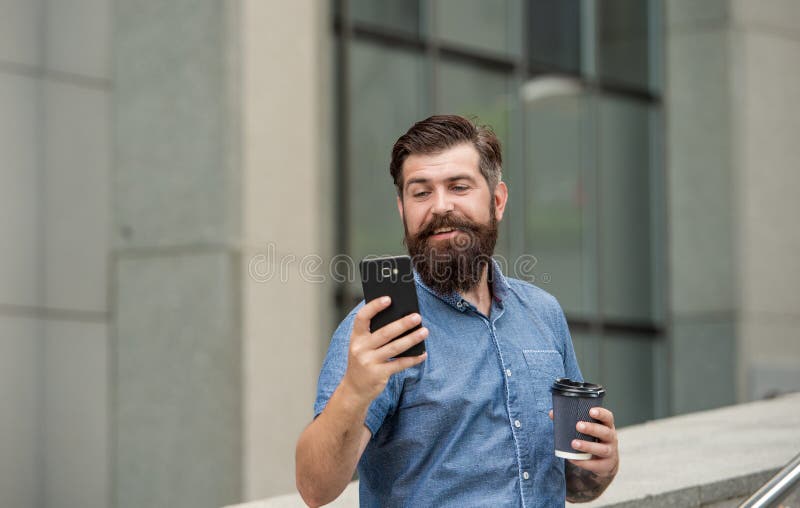 Happy Man Making Video Call Using Mobile Phone. Bearded Man Smiling To ...