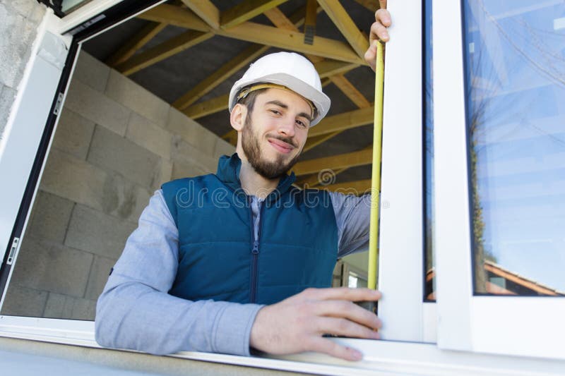 Happy man measuring window stock image. Image of measure - 282724235