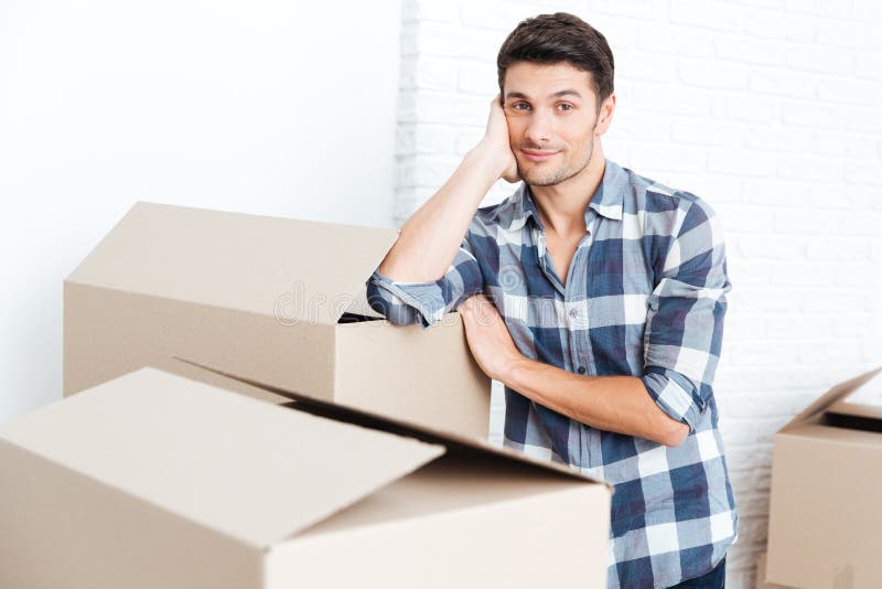 Happy Man Moving in and Carrying Carton Boxes Stock Image - Image of ...