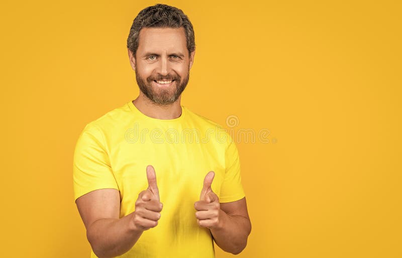 Happy Man Offering Advertisement Isolated on Yellow, Copy Space. Man ...