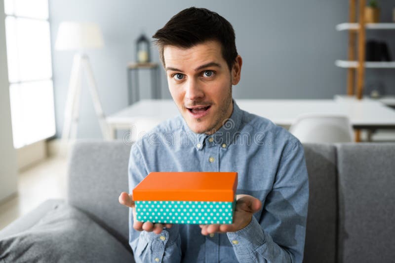Happy Man Opening Gift stock photo. Image of cardboard - 212708414