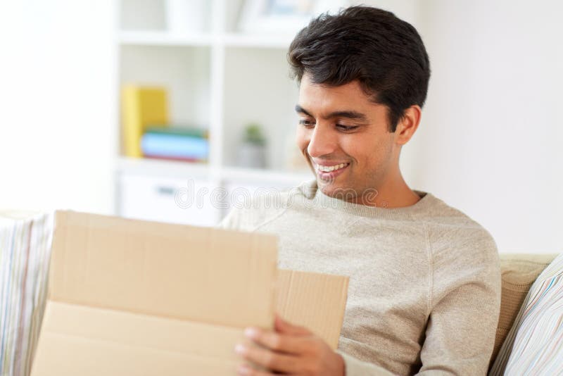 Happy Man Opening Parcel Box at Home Stock Image - Image of purchase ...
