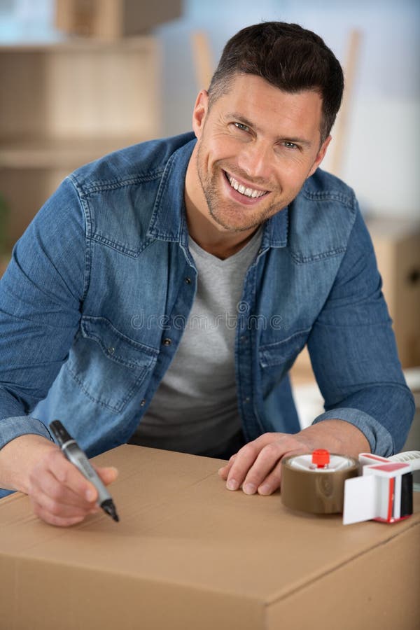 Happy Man Packs Gift Parcel on Table Stock Image - Image of delivery ...