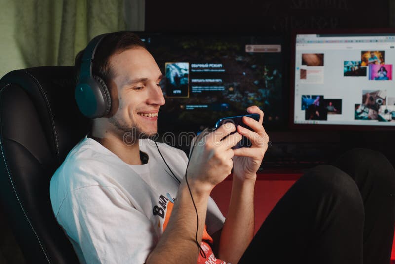 Happy Man Playing a Mobile Game Stock Photo - Image of lifestyle, gamer ...