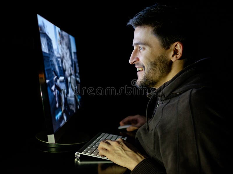 Happy Man Playing Videogame on Desktop Computer Stock Photo - Image of ...
