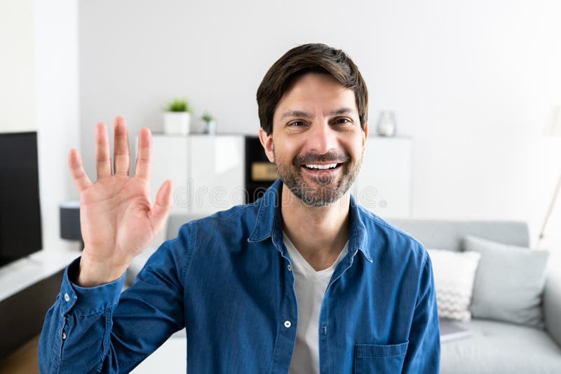 Happy Man Portrait Waving To Webcam Stock Photo - Image of couch, happy ...