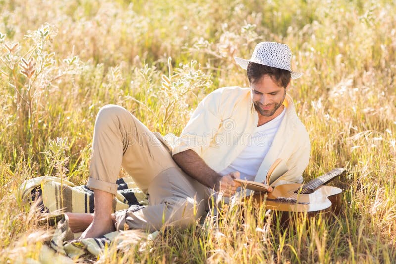 Happy man reading a book stock photo. Image of guitar - 50465096 Happy man reading a book stock photo. Image of guitar - 50465096
