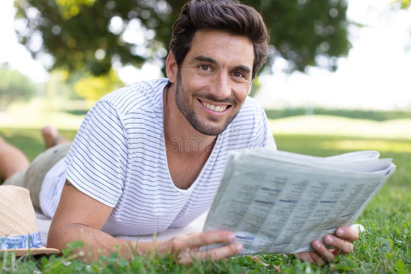 Happy Man Reading Newspaper in Park Stock Photo - Image of resting ... Happy Man Reading Newspaper in Park Stock Photo - Image of resting ...