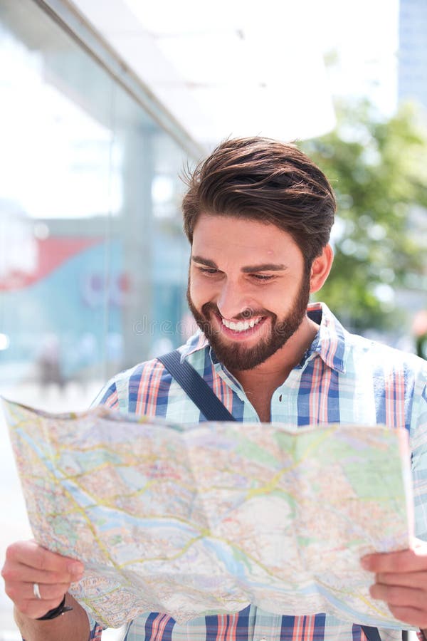 Happy Man Reading Road Map in City Stock Image - Image of foreground ...