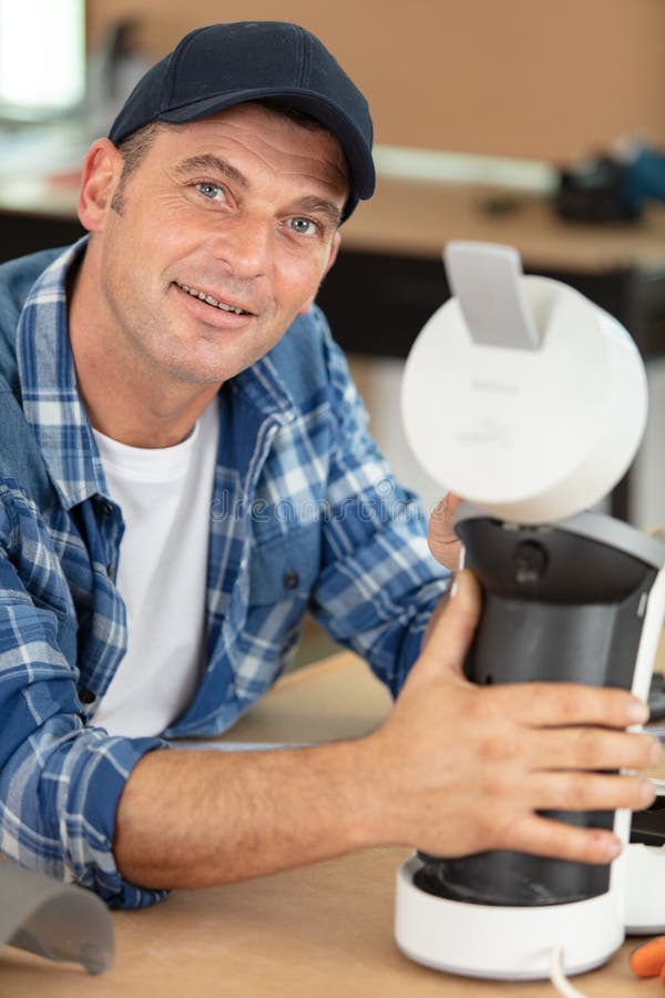 Happy Man Repairing Broken Coffee Machine Stock Photo - Image of huge ...