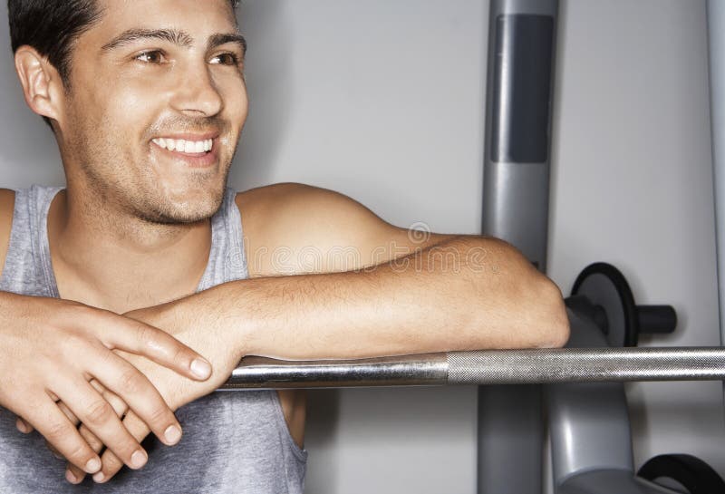 Happy Man Resting on Barbell after Workout Stock Photo - Image of ...