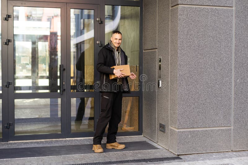 Happy Man Ringing Intercom with Camera in Entryway. Stock Photo - Image ...
