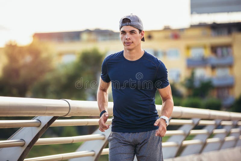 Happy Man Running on Bridge Stock Photo - Image of fitness, jogger ...