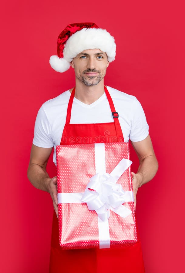 Happy Man in Santa Hat and Red Apron Hold Present Stock Photo - Image ...