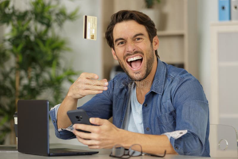 Happy man shopping online stock image. Image of bank - 216127339