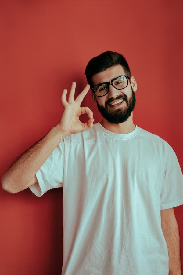 Happy Man Showing Ok Sign Isolated on Red Stock Photo - Image of ...